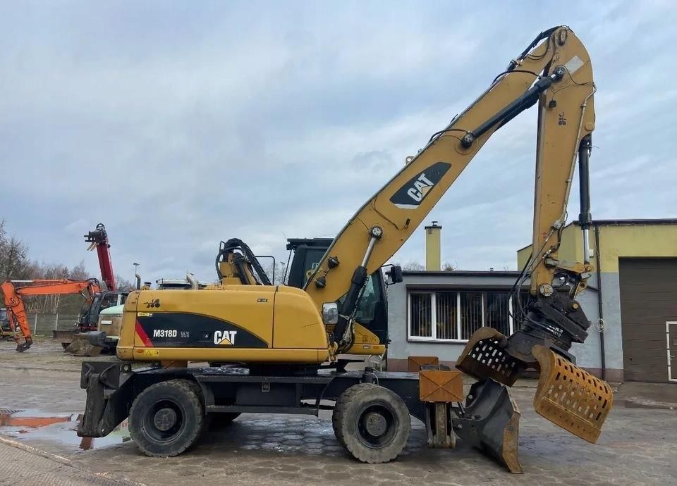 Caterpillar M318D MH - Opinie i ceny na Ceneo.pl
