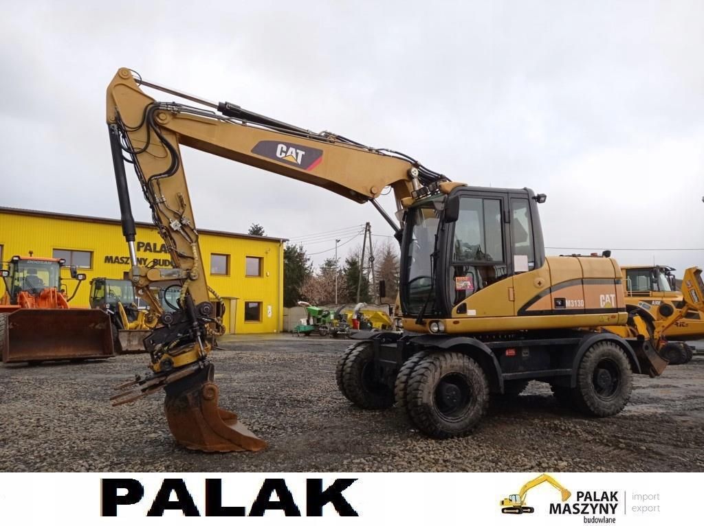 Koparka kołowa CAT M 313 D + ROTATOR , 2008 rok - Opinie i ceny na Ceneo.pl