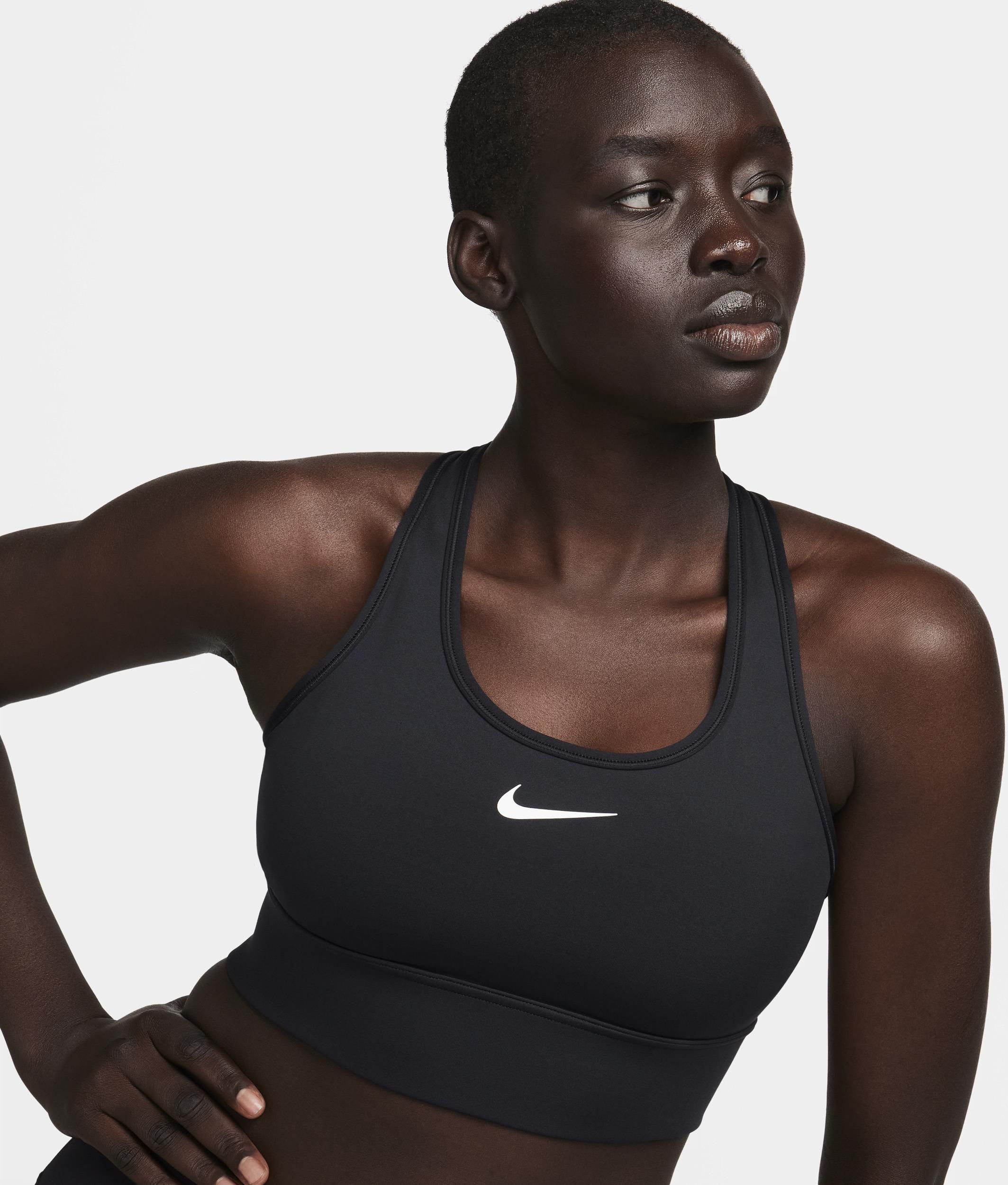 Damski stanik sportowy o wydłużonym kroju z wkładkami Nike Swoosh ...