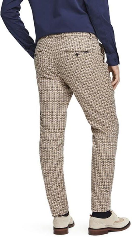 Spodnie marki Scotch & Soda model 157511 kolor Brązowy. Odzież męska ...