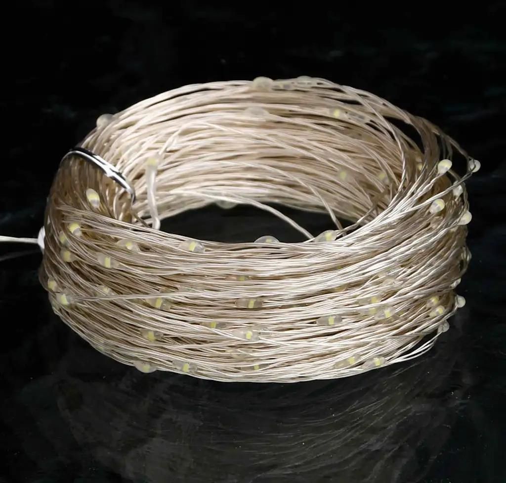 Lampki LED 150 diod 15 m z pilotem Gravora zimny biały miedziany drut ...